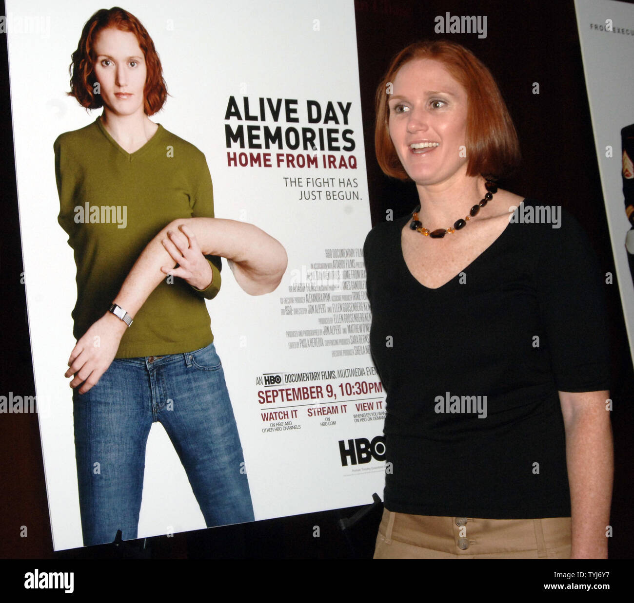 1st Lt. Dawn Halfaker (Army) poses in front of her film poster for the ...