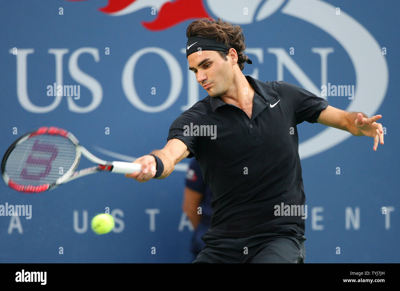Roger Federer hits a forehand while playing Novak Djokovic in the U.S ...