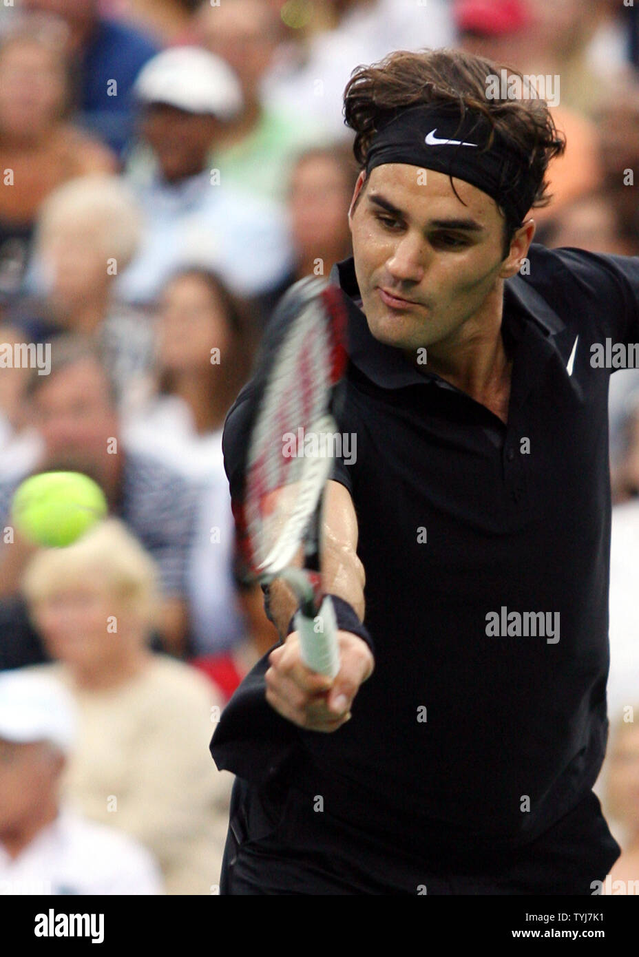 Roger Federer reaches to return a serve while playing Novak Djokovic in ...