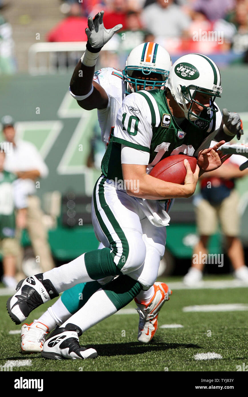 New York Jets Chad Pennington gets sacked for a 9 yard loss by Miami ...