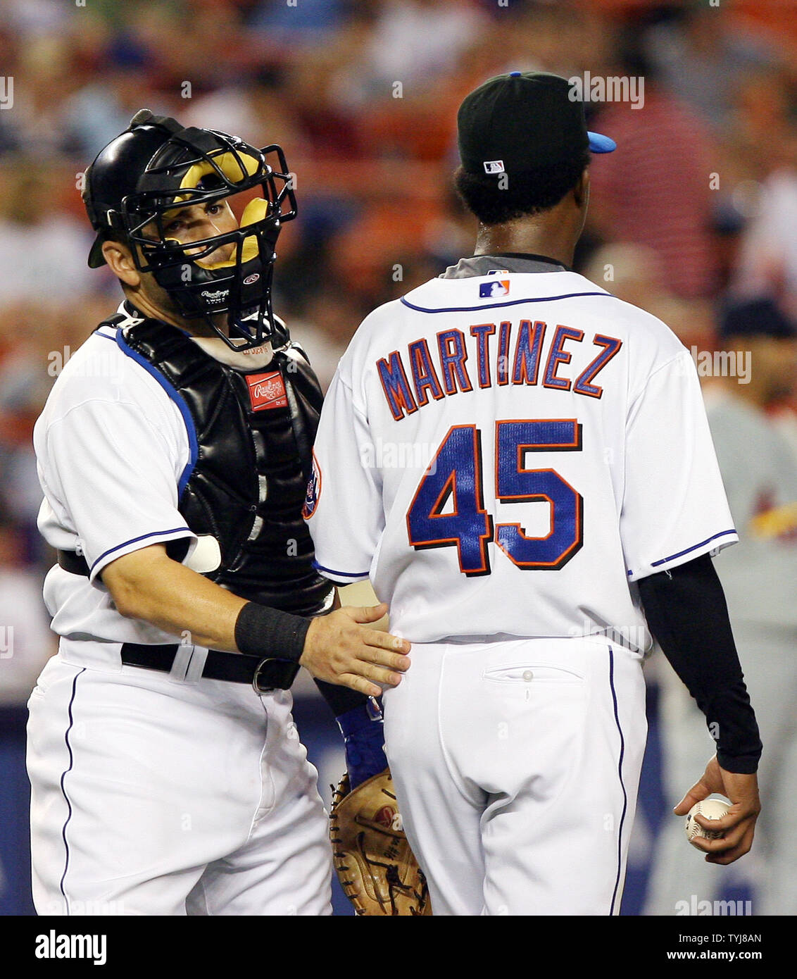 New York Mets starting pitcher Pedro Martinez gets a tap on the back by ...