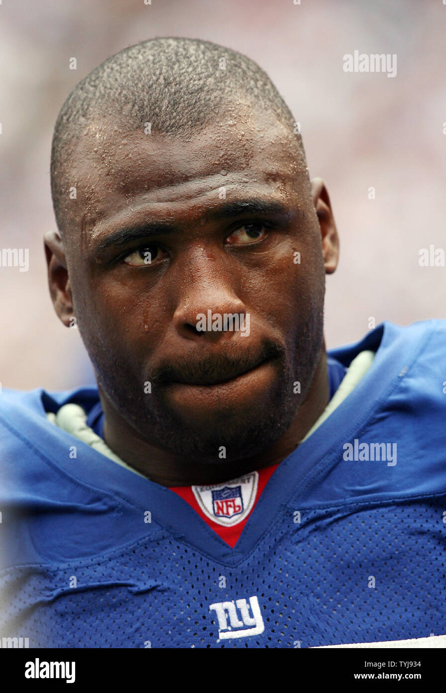 New York Giants Brandon Jacobs stands on the sidelines in the first ...