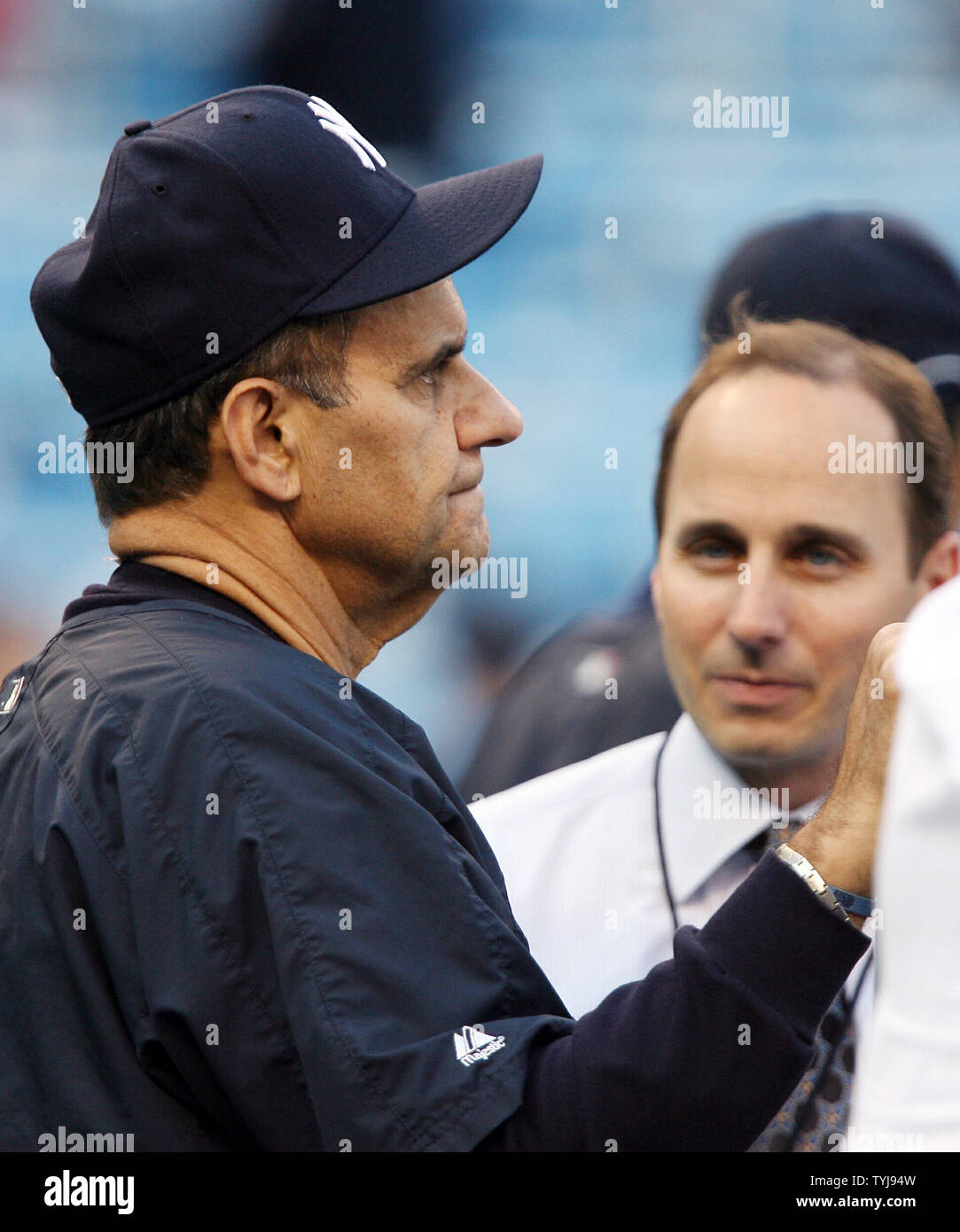 New York Yankees general manager Brian Cashman looks at manager Joe ...