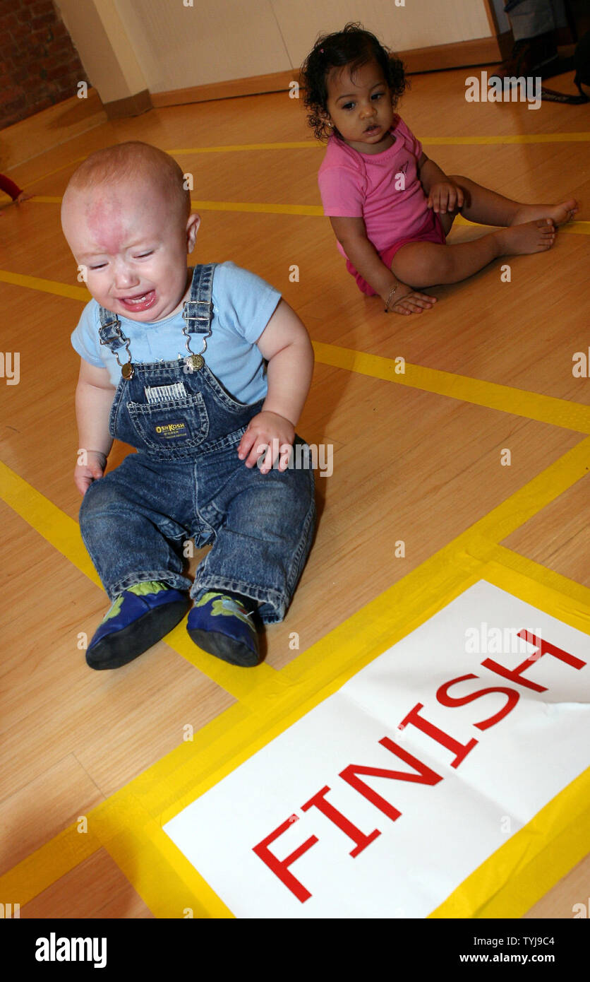 A baby breaks out in tears just before reaching the finish line during ...