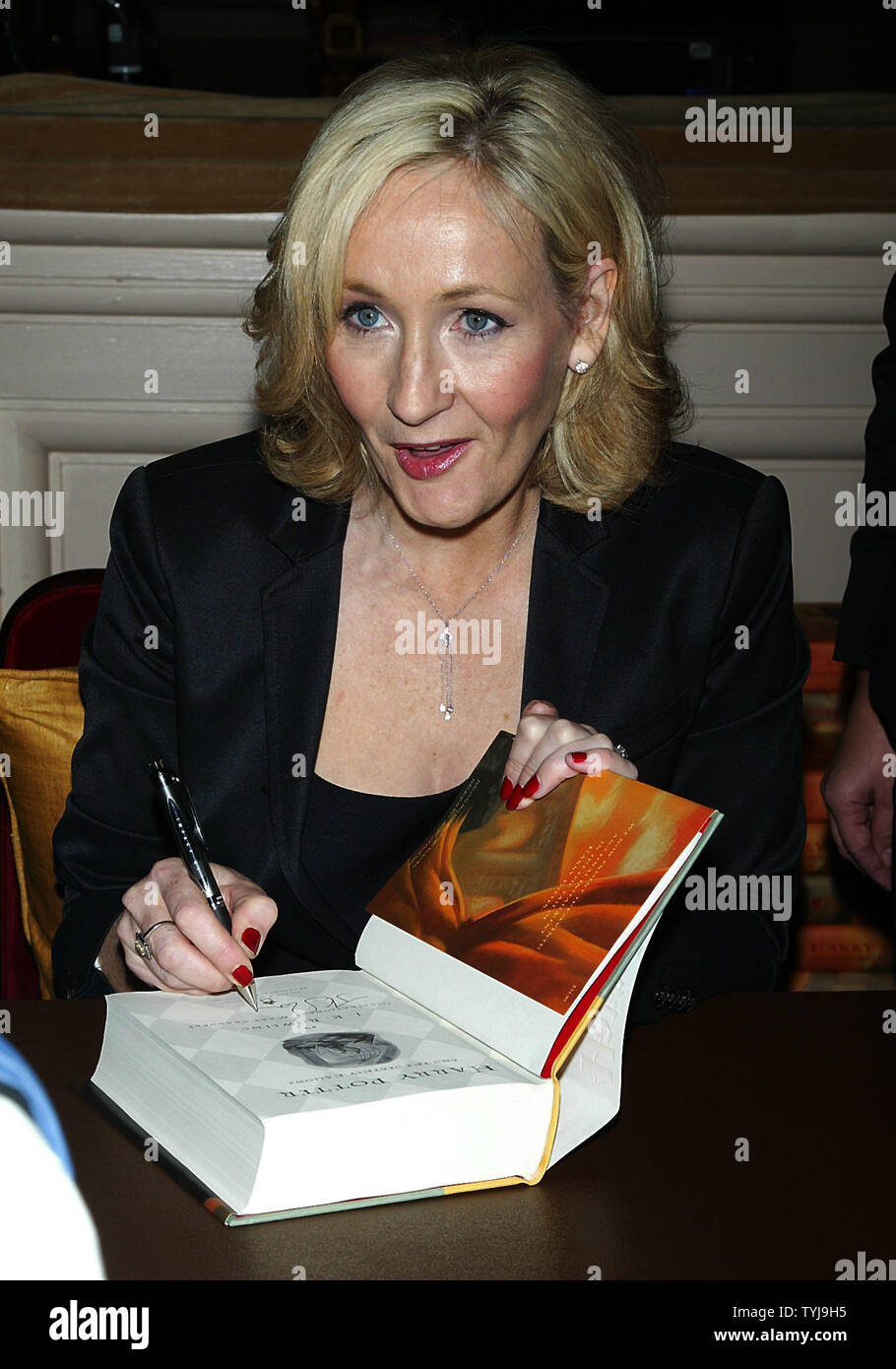 J.K. Rowling signs copies of her book "Harry Potter and the Deathly ...