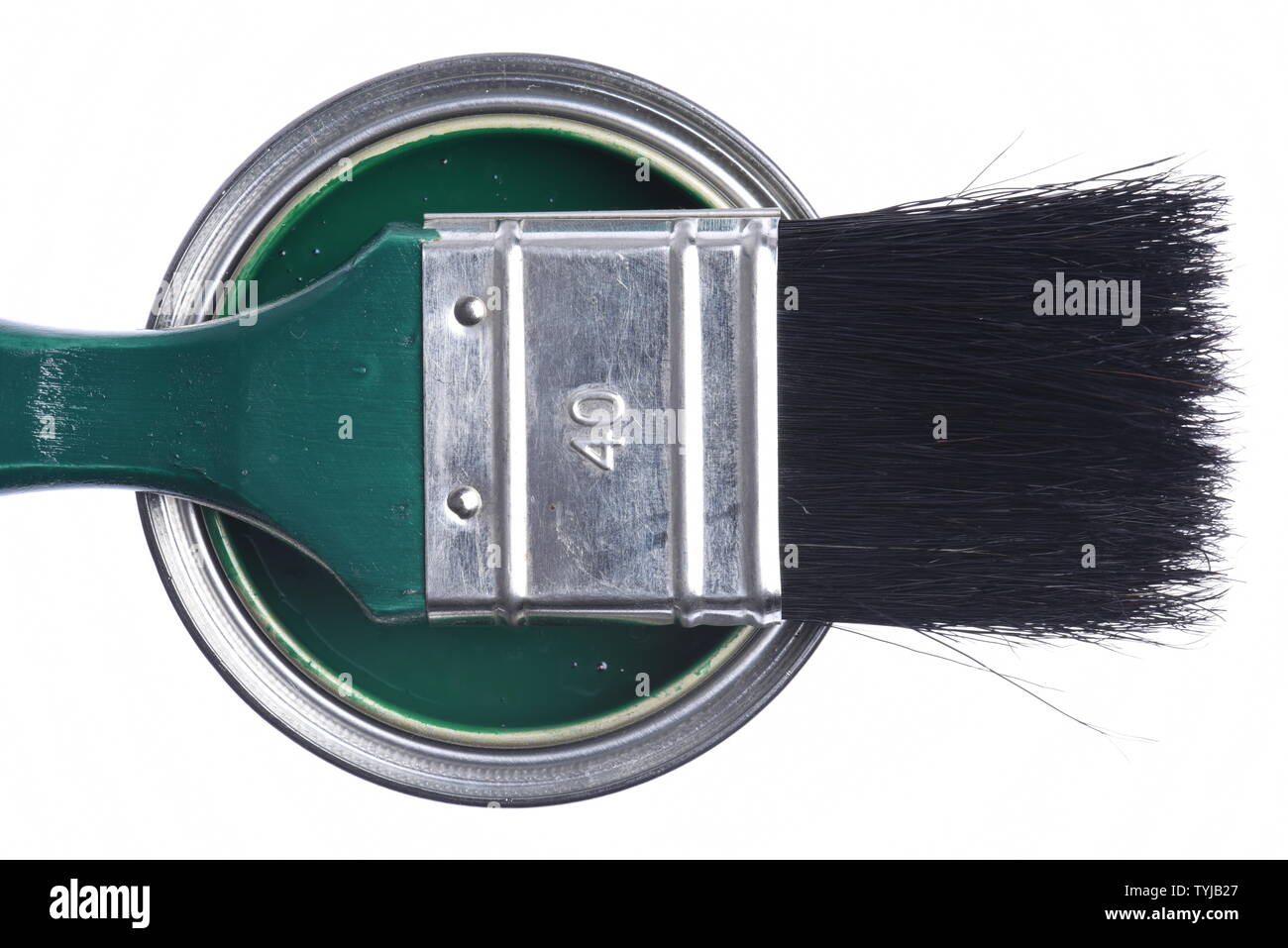 Green paint can with brush isolated on white background, directly above ...