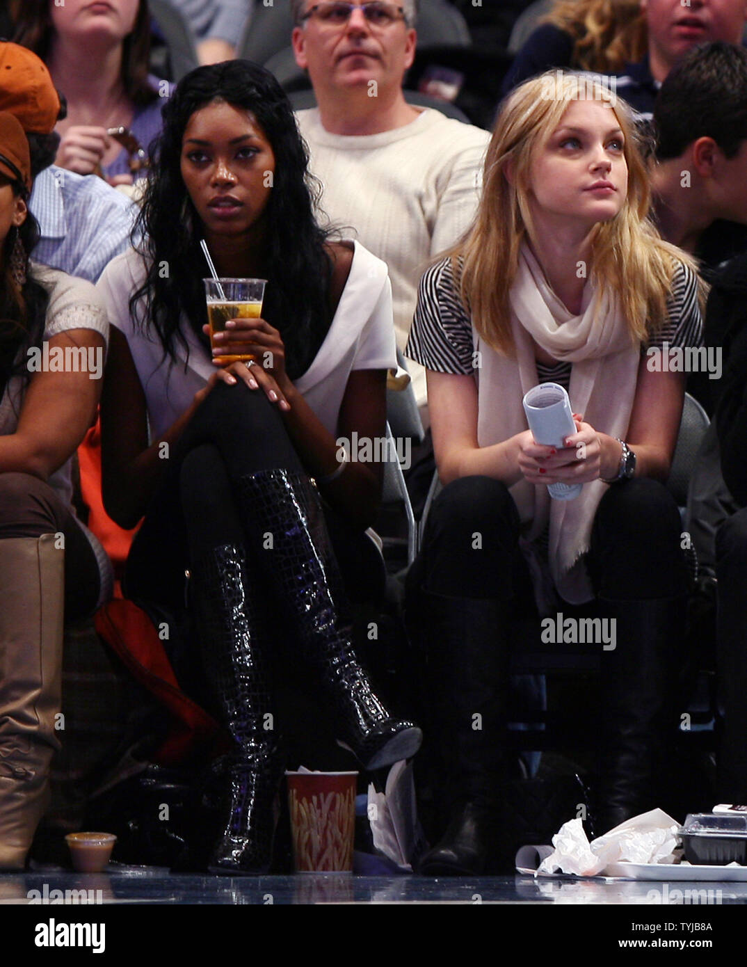 Jessica White (L) and Jessica Stam watch the New York Knicks play the ...