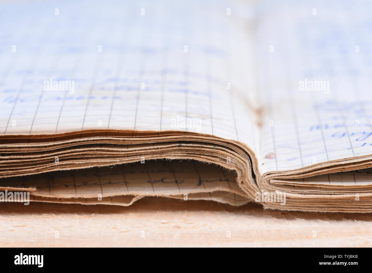 Edges of old opened notebook Stock Photo - Alamy