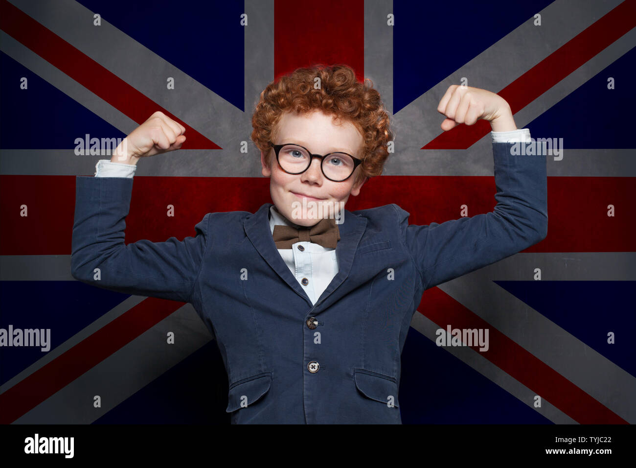 Child boy student on the UK flag background. Learn English concept ...
