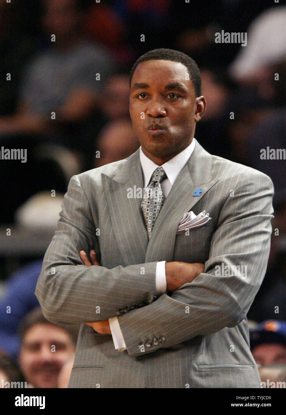 New York Knicks head coach Isiah Thomas folds his arms in the second ...