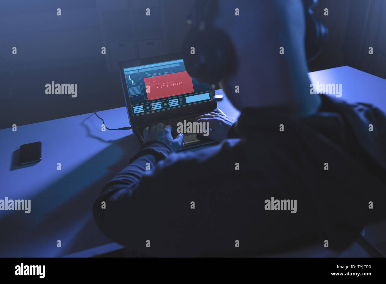 hacker with access denied message on laptop Stock Photo - Alamy