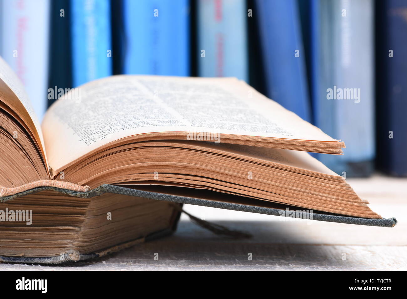 Close up of opened book with blurry background Stock Photo - Alamy