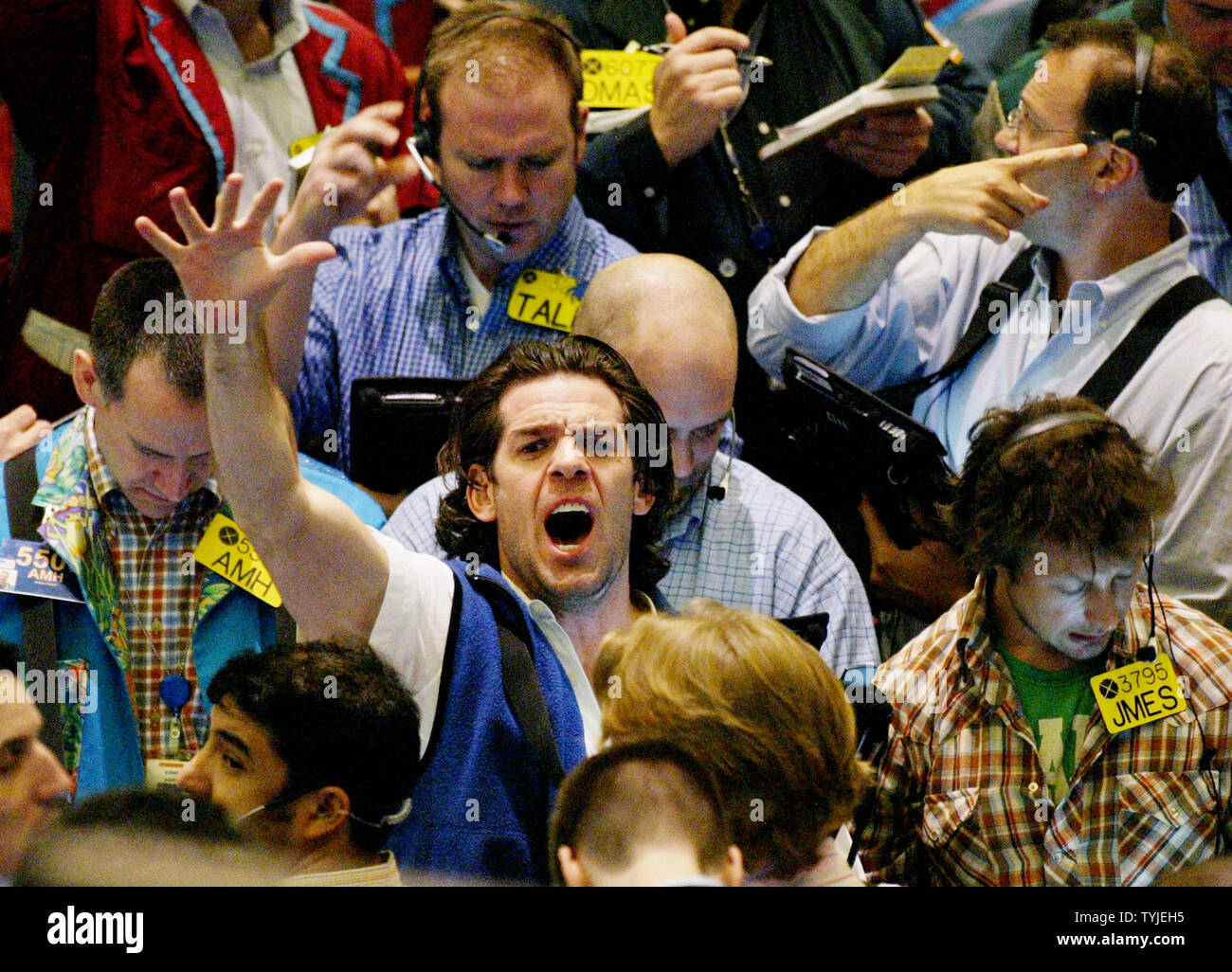 Traders conduct business in the oil options pit at the NYMEX after ...