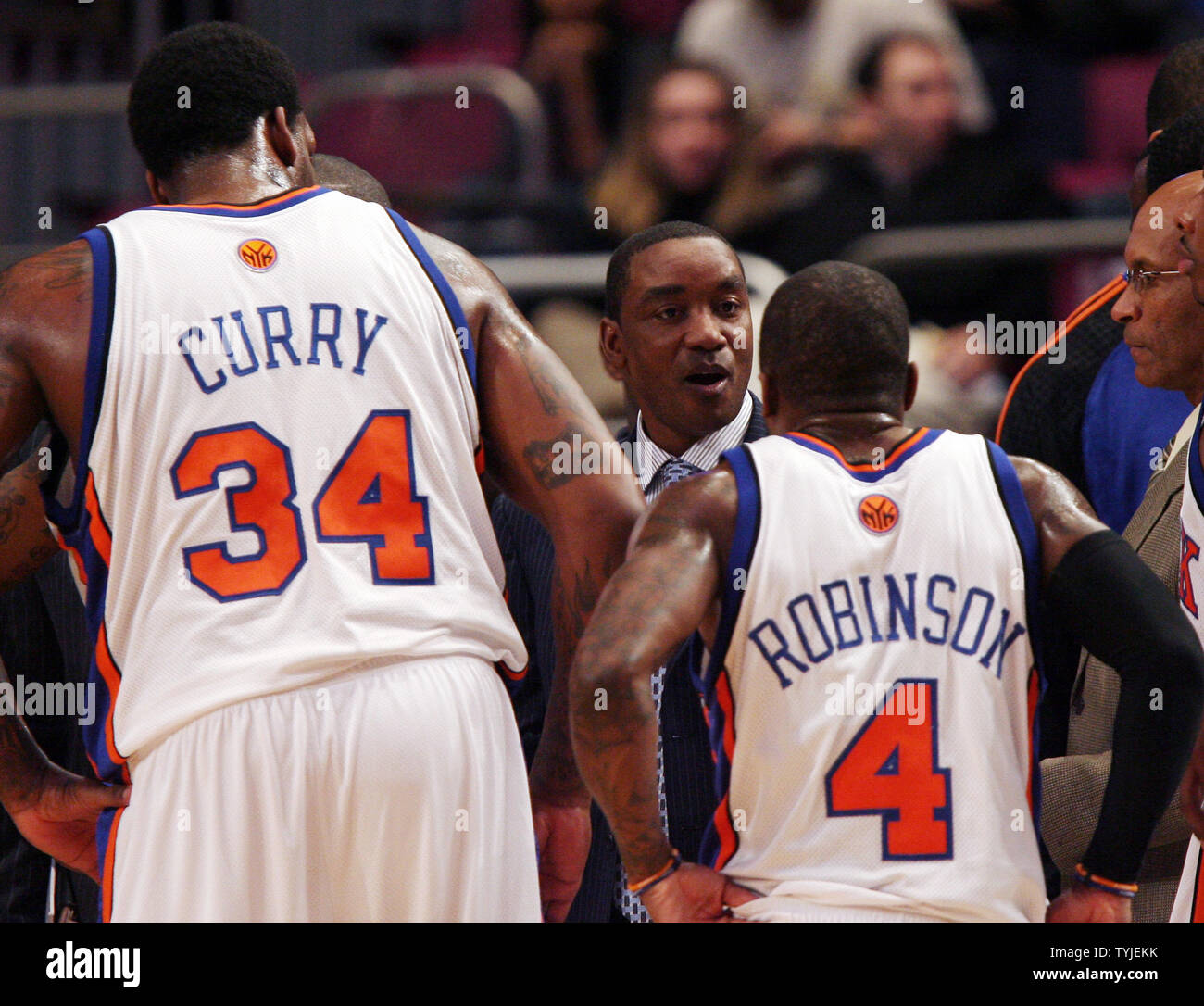 New York Knicks head coach Isiah Thomas talks with Eddy Curry and Nate ...
