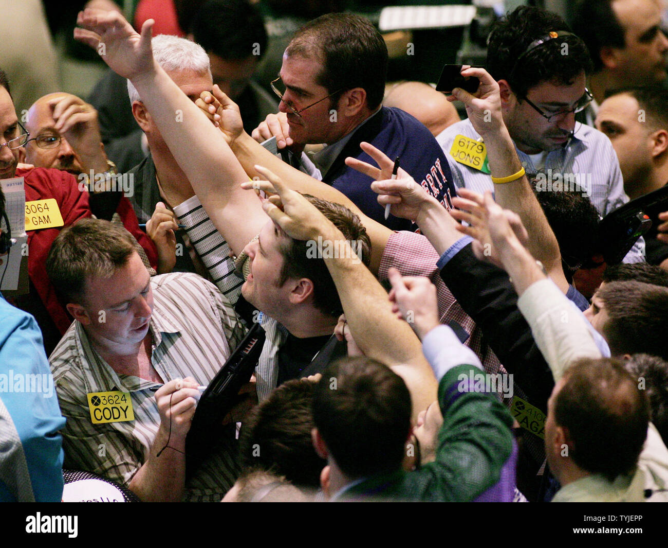 Traders conduct business in the oil options pit at the NYMEX as oil ...
