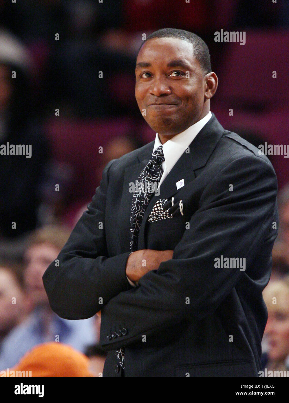 New York Knicks head coach Isiah Thomas cracks a smile in the first ...