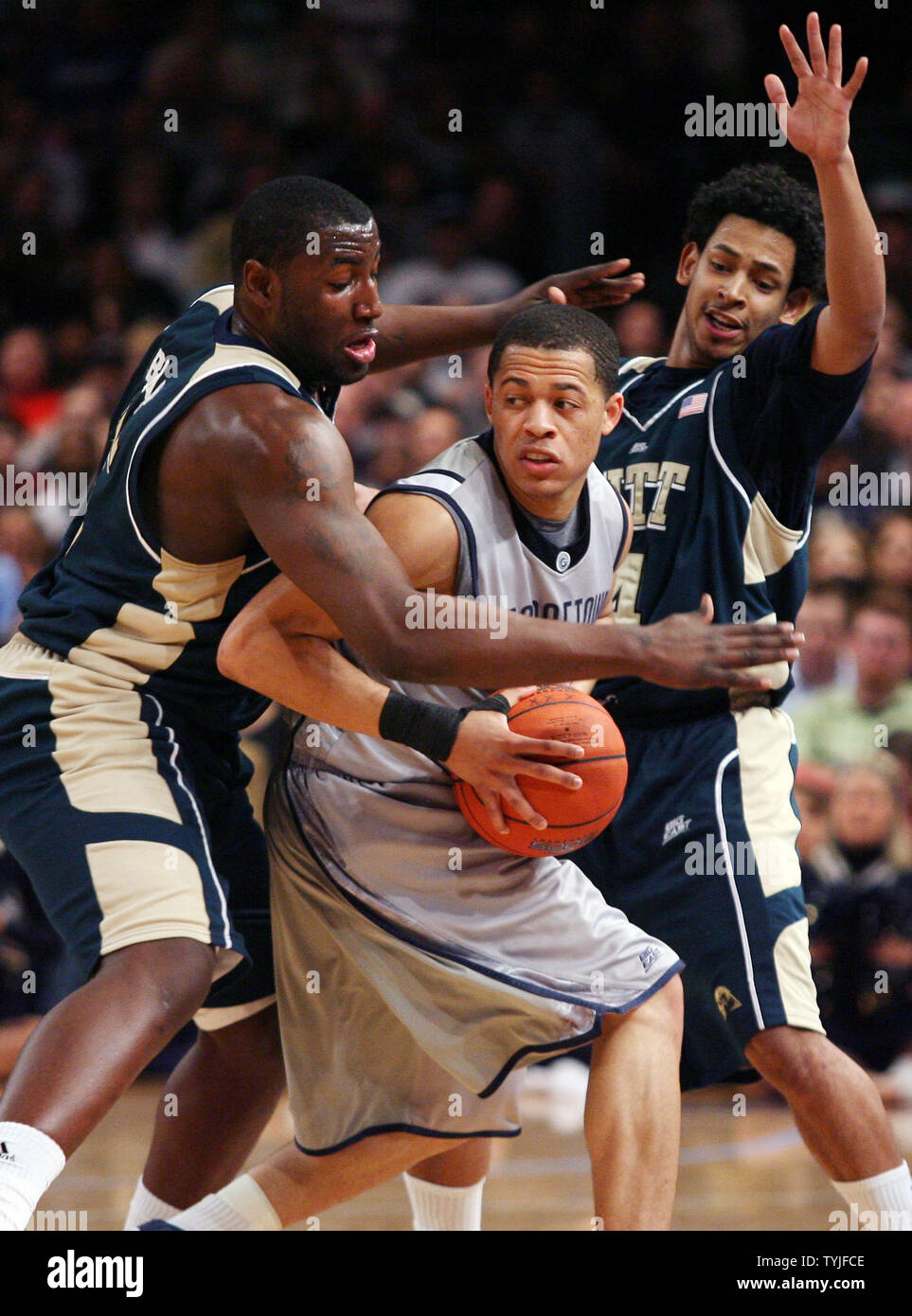 Georgetown Hoyas Jonathan Wallace fights off Pittsburgh Panthers DeJuan ...