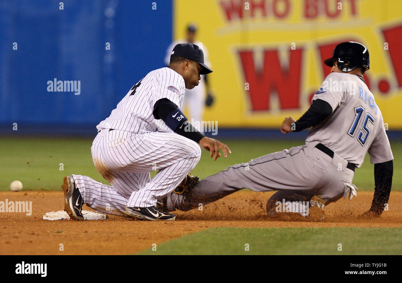 Toronto Blue Jays Alex Rios (15) slides into second base safely as the ...