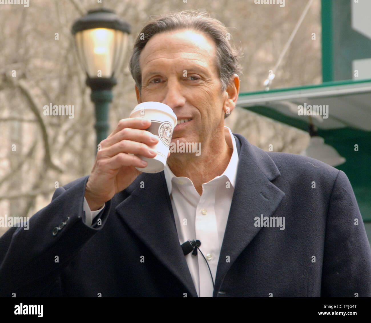 Howard Schultz,chairman and CEO of Starbucks Coffee, toasts and tastes ...