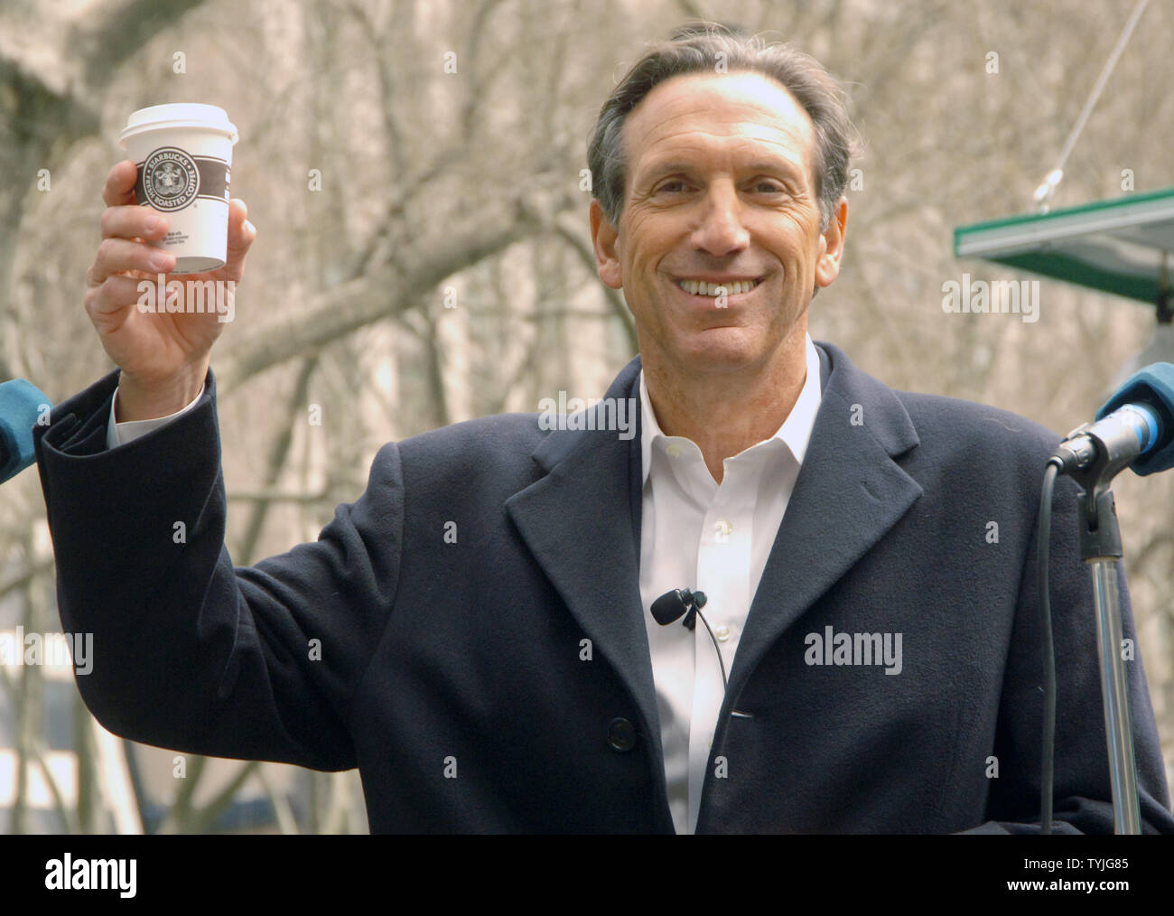 Howard Schultz,chairman and CEO of Starbucks Coffee, toasts and tastes ...