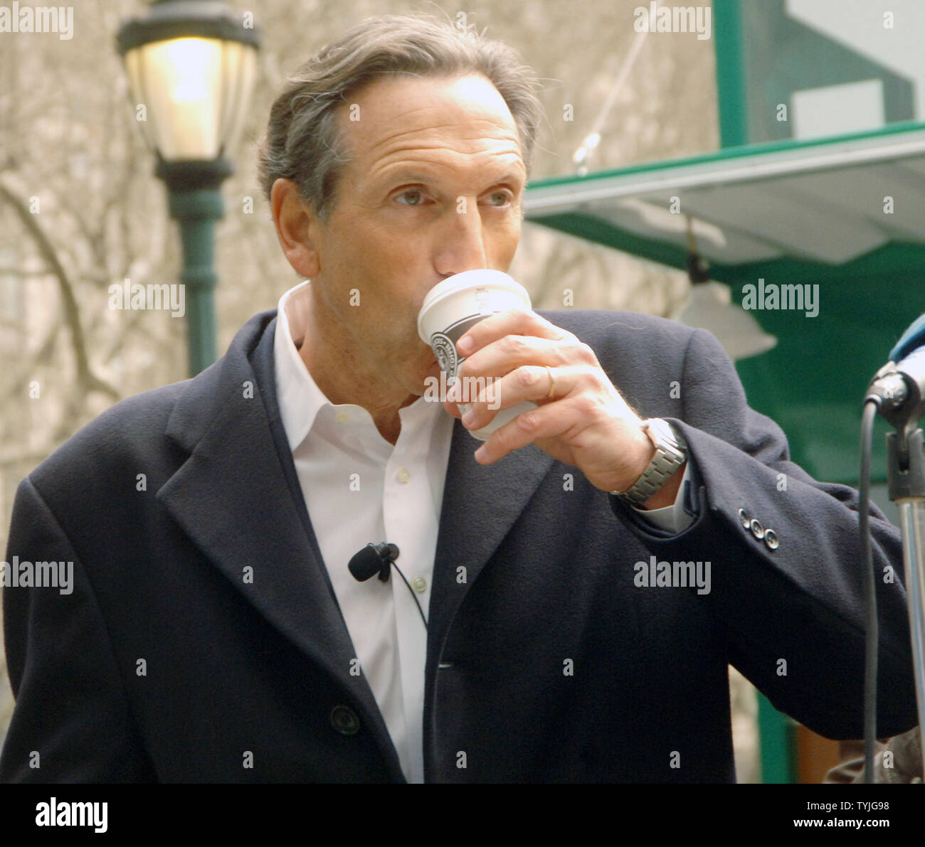 Howard Schultz,chairman and CEO of Starbucks Coffee, toasts and tastes ...