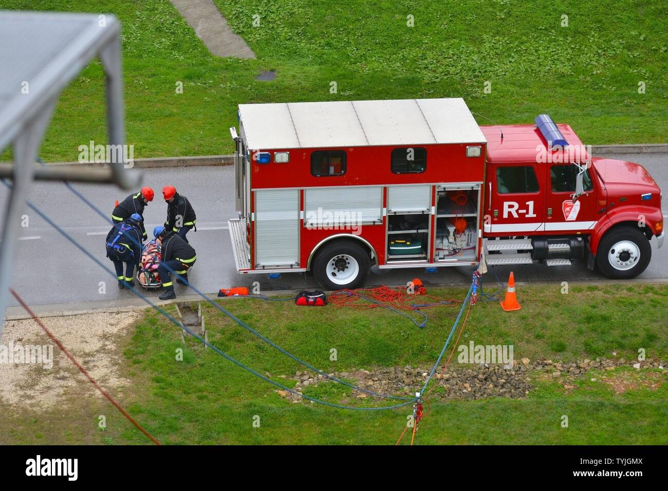 Firefighters assigned to the U.S. Army Garrison Italy, transport a ...
