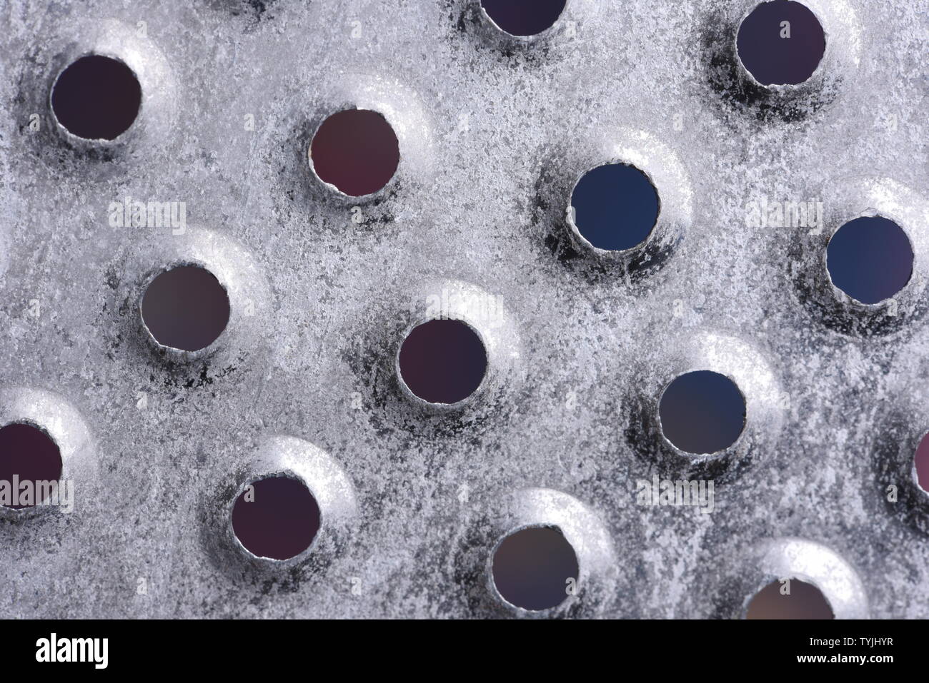 Gray metal holes texture hi-res stock photography and images - Alamy