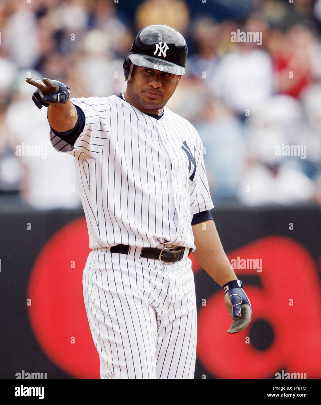 New York Yankees Bobby Abreu points after hitting a double in the ...