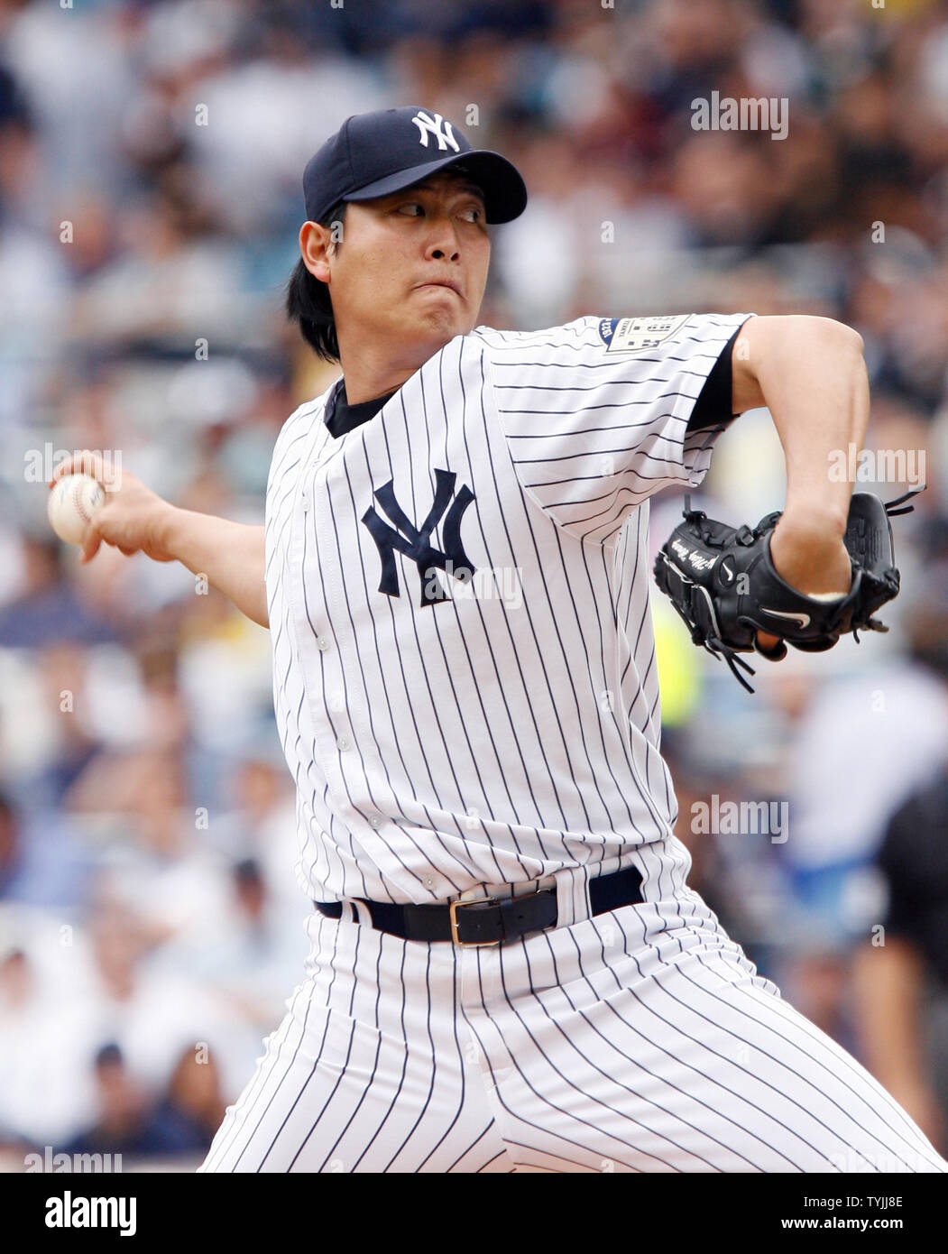 New York Yankees starting pitcher Chien-Ming Wang throws a pitch in the ...