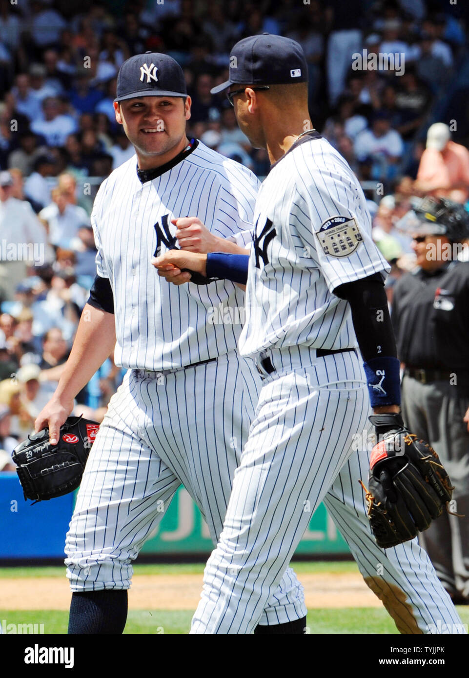 New York Yankees starting pitcher Joba Chamberlain joins fists with ...