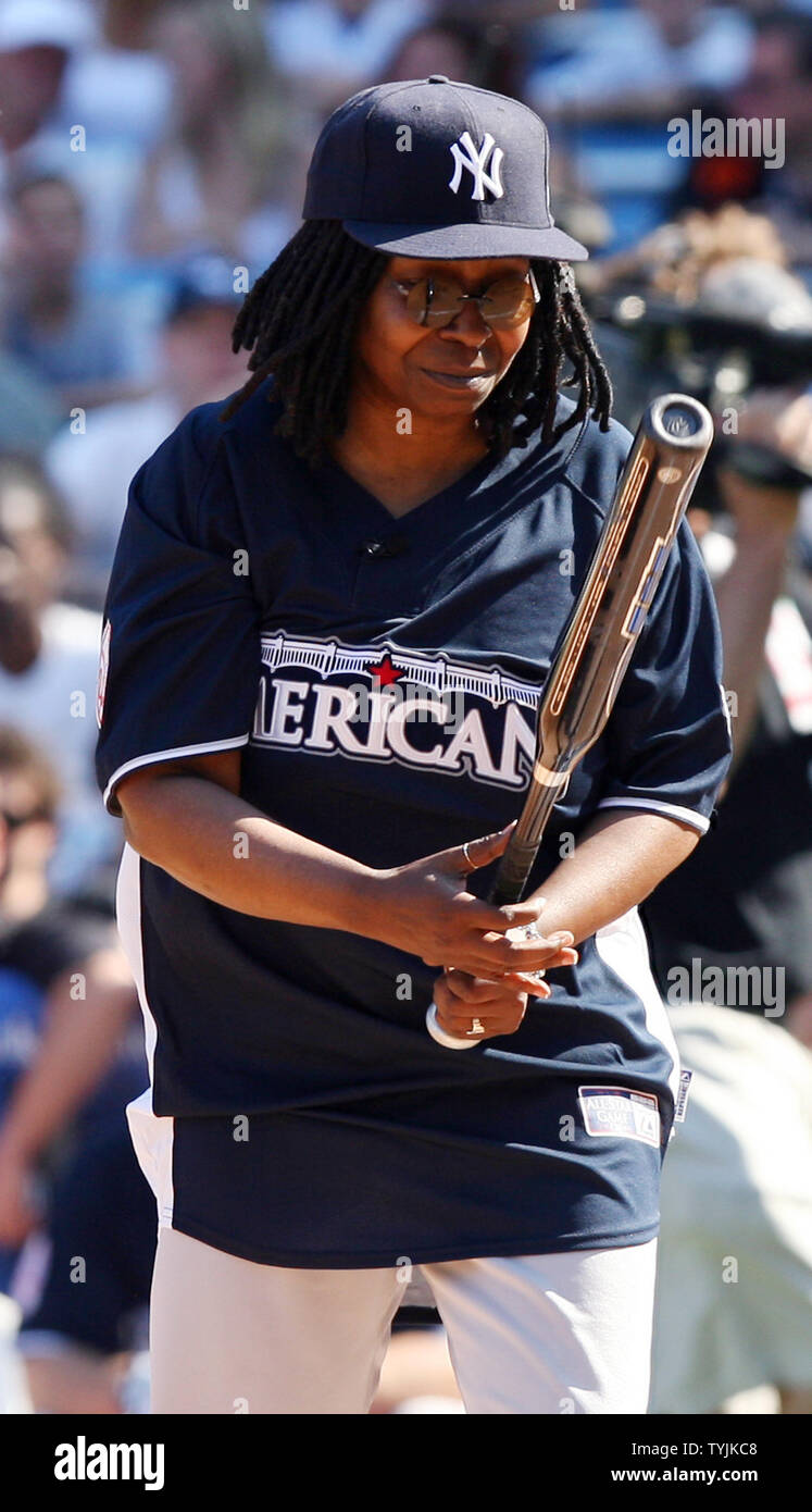 Whoopi Goldberg grabs a bat at the Taco Bell All-Star Legends ...