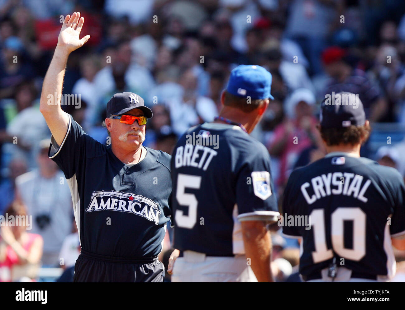 Rich "Goose" Gossage raises his hand next to George Brett and Billy ...