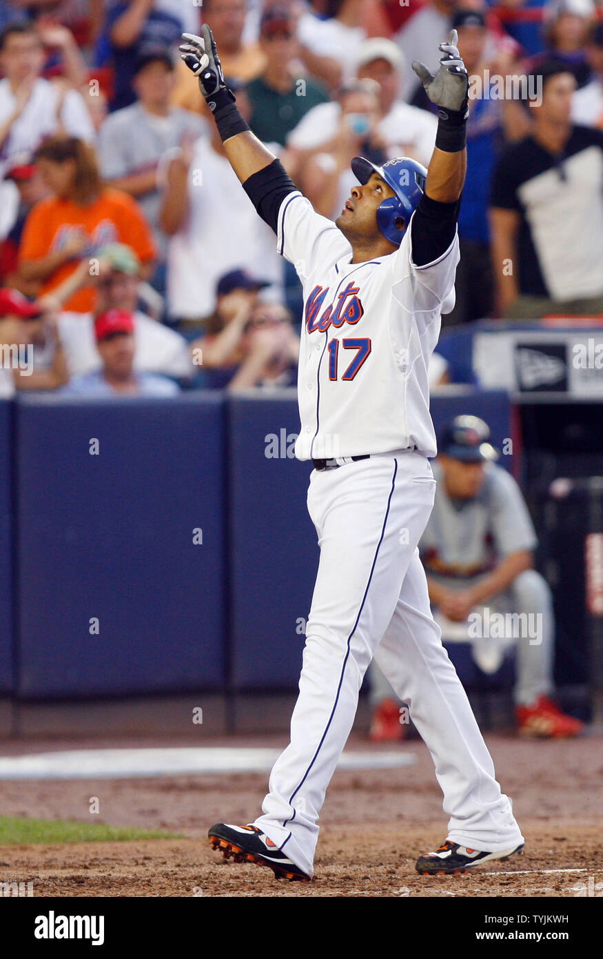 New York Mets Fernando Tatis puts his hands in the air while crossing ...