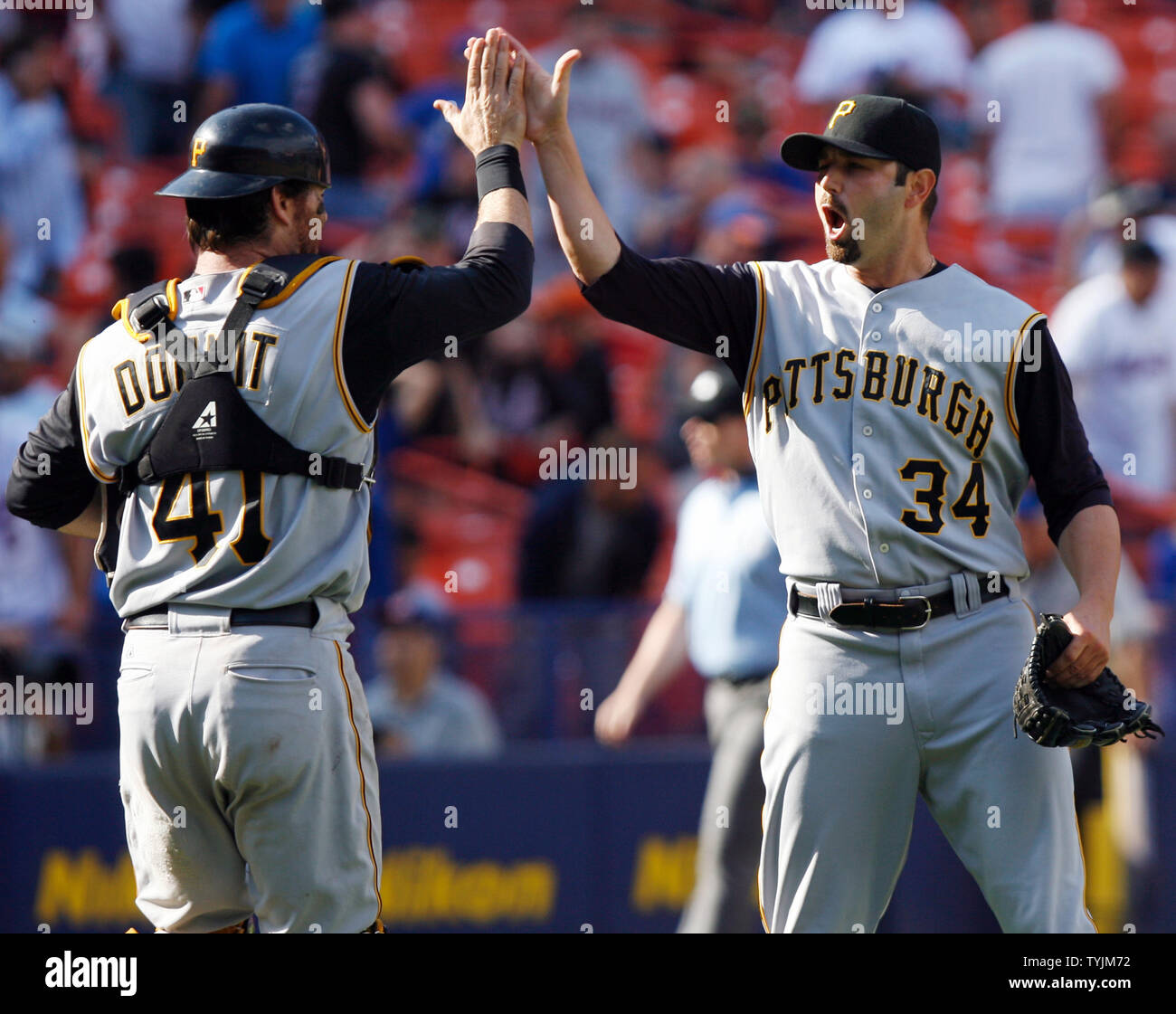 Pittsburg Pirates relief pitcher John Grabow slaps the hand of Ryan ...