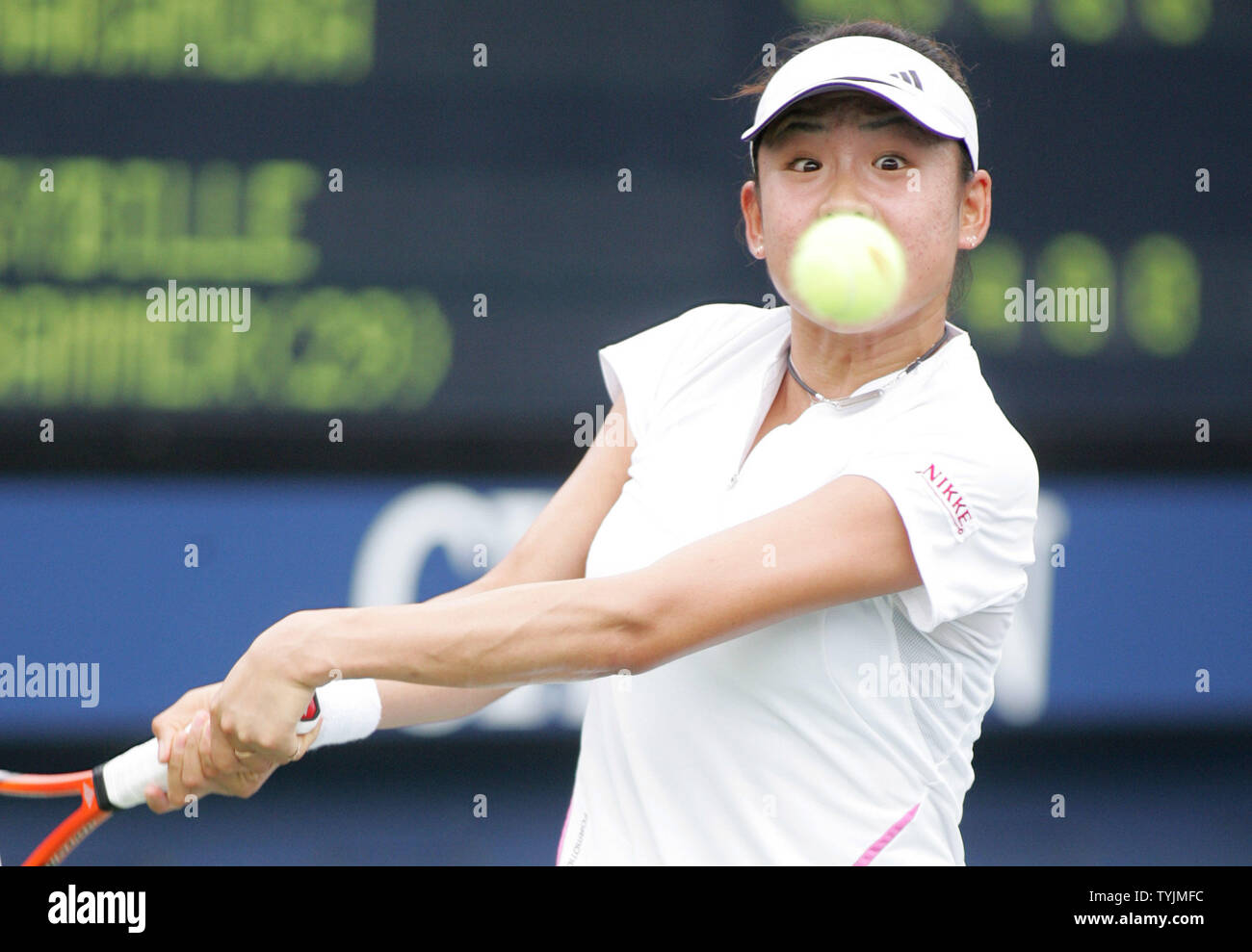 Japan's Aiko Nakamura returns the ball to Sybille Bammer of Austria in ...