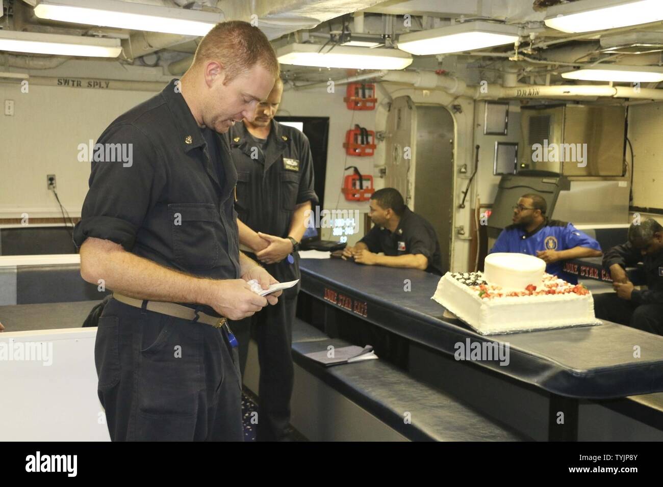 ARABIAN GULF (Nov. 11, 2016) Chief Petty Officer Travis Rogers gives an ...
