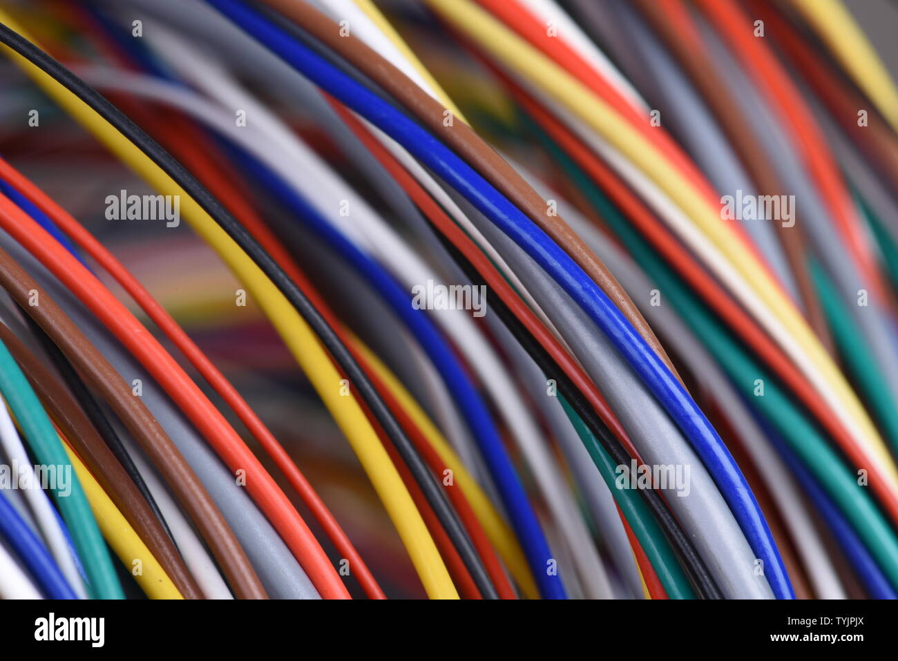 Colored telecommunication cable and wire closeup Stock Photo - Alamy