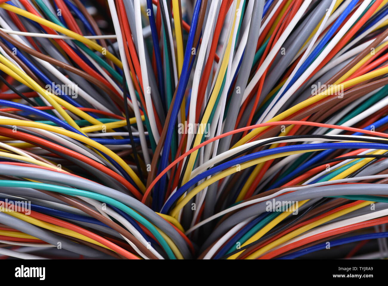 Bundle of colorful wires and cables closeup, used in telecommunication ...