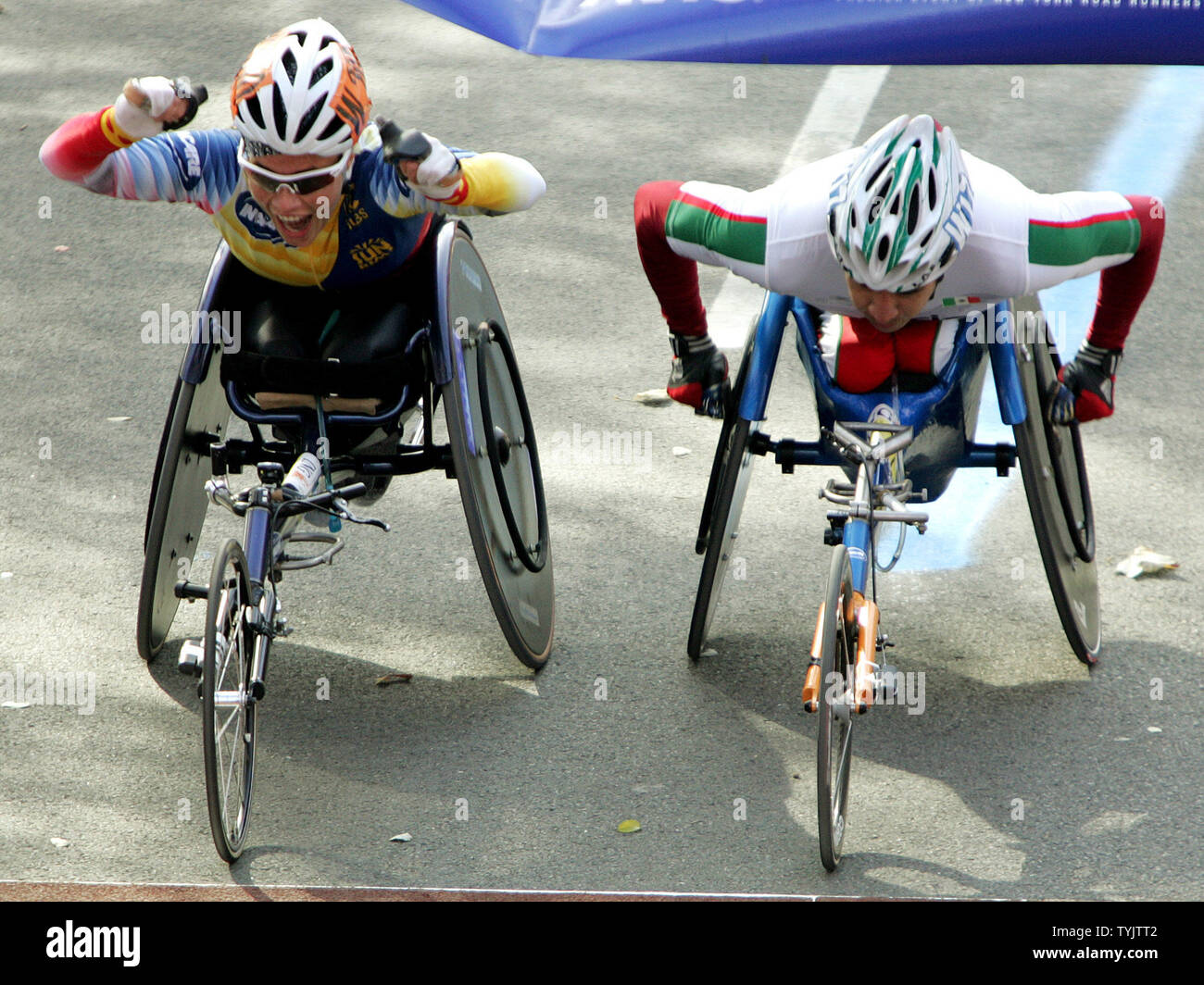 Edith Hunkeler (L) of Switzerland celebrates as she crosses the finish ...
