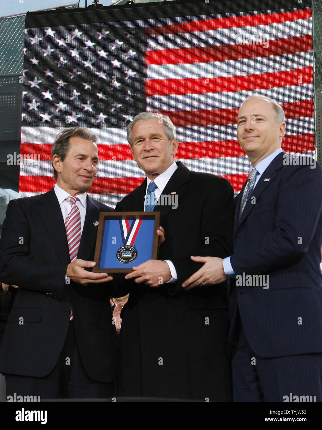 Charles de Gunzburg, President George W. and Richard Santulli (L) stand ...