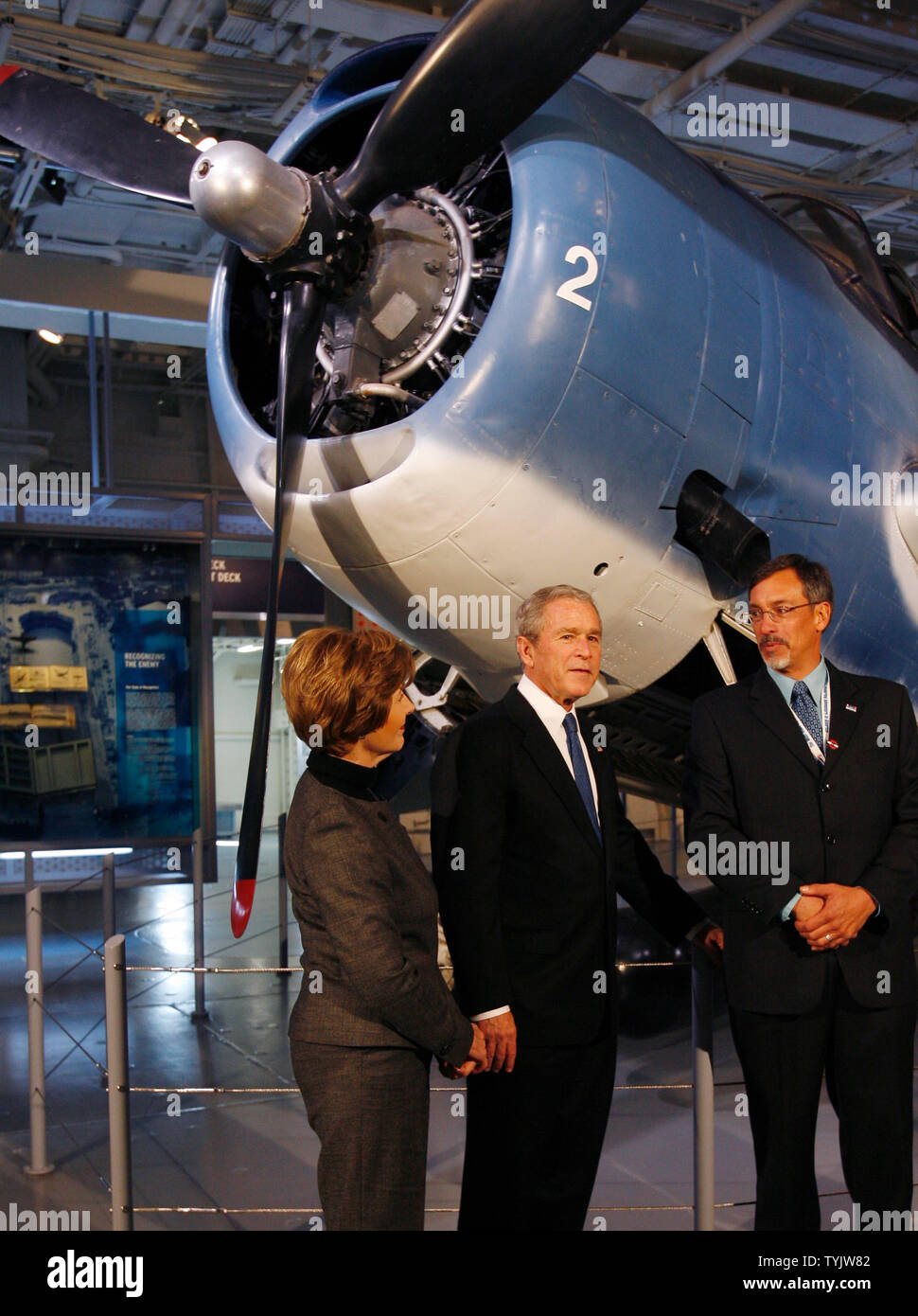 Laura Bush, President George W. Bush and Eric Boehm stand in front of a ...