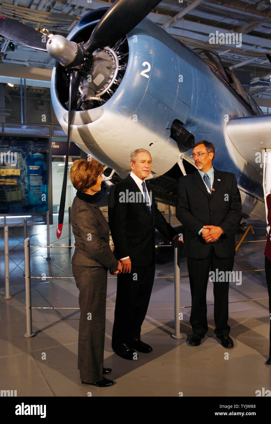 Laura Bush, President George W. Bush and Eric Boehm stand in front of a ...