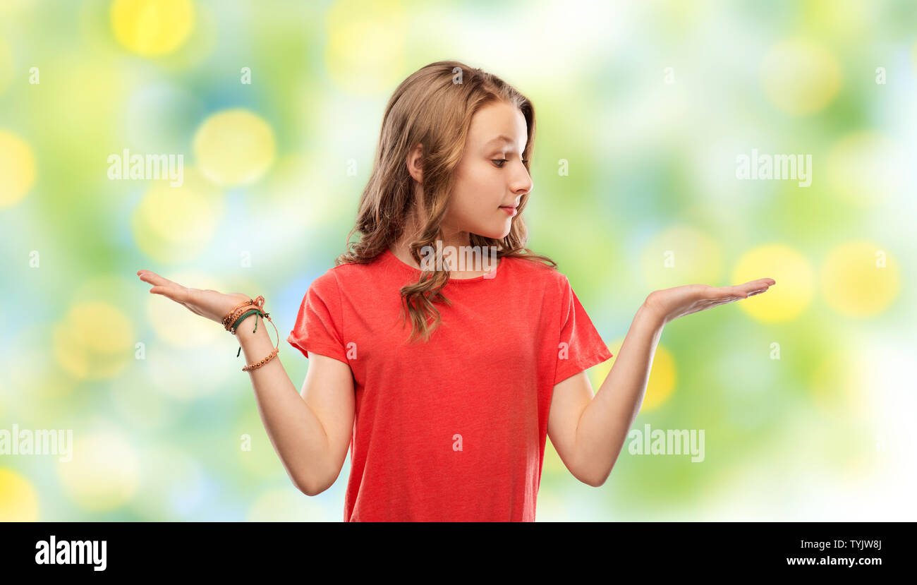 smiling teenage girl holding empty hand Stock Photo - Alamy