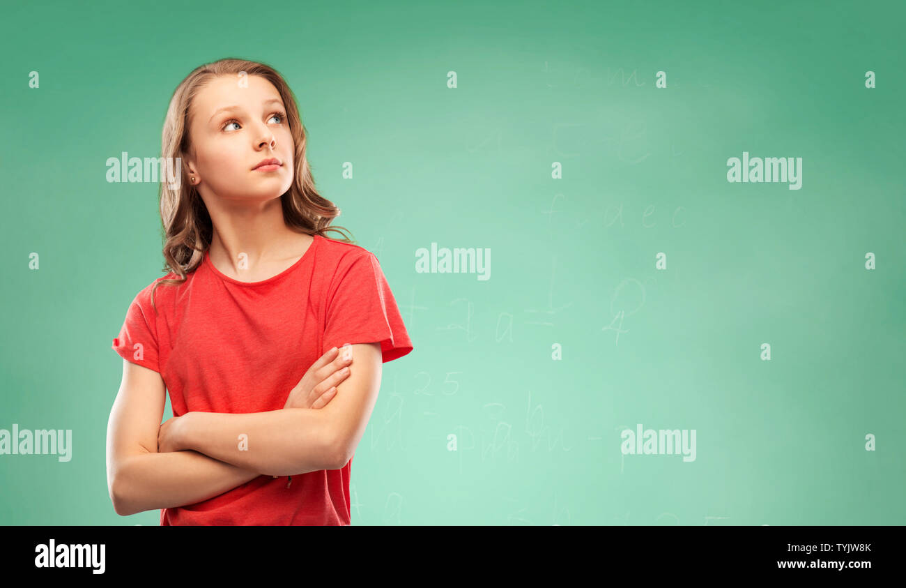 student girl with crossed arms over green Stock Photo - Alamy