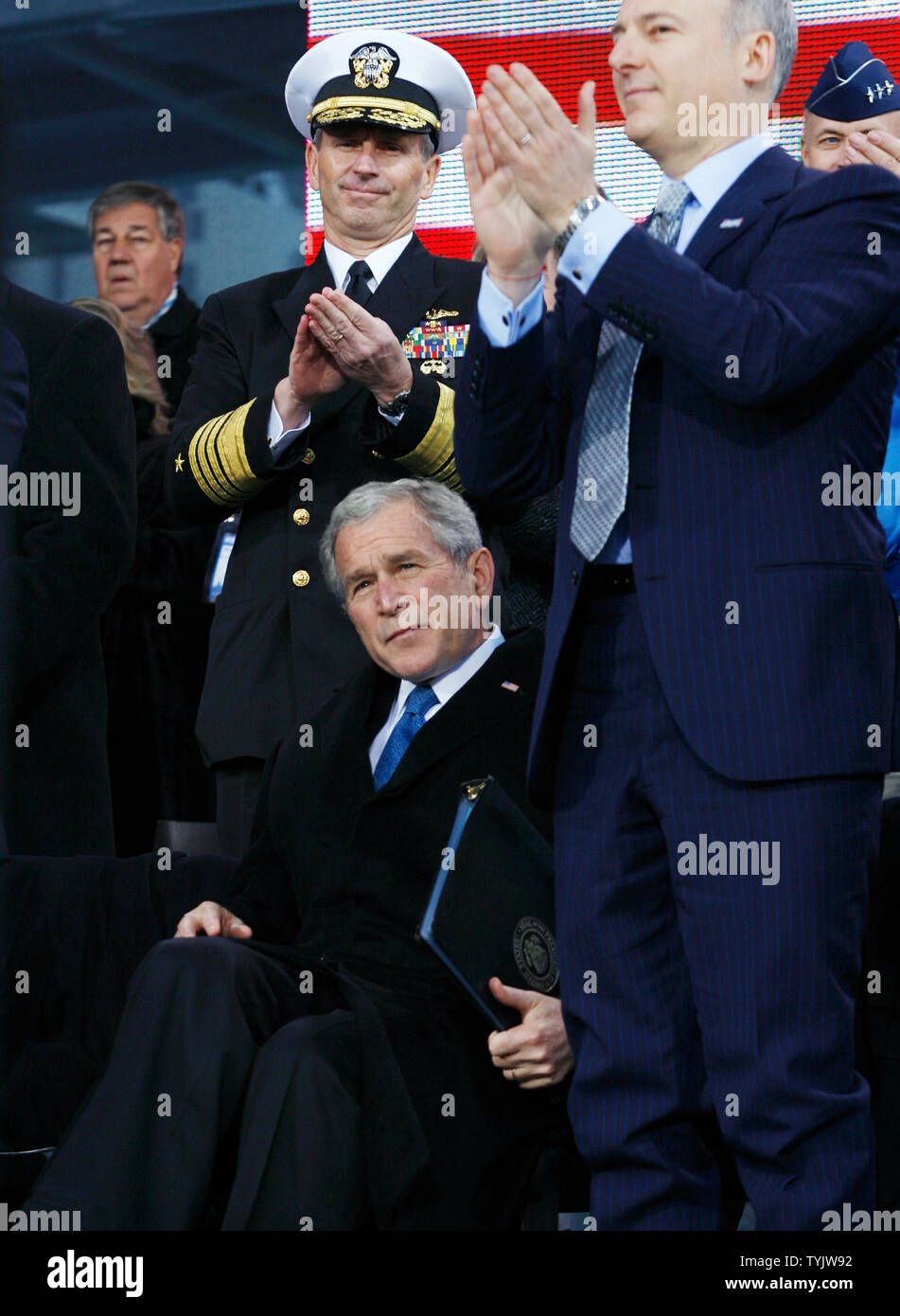 President George W. Bush sits as he receives a standing ovation on ...
