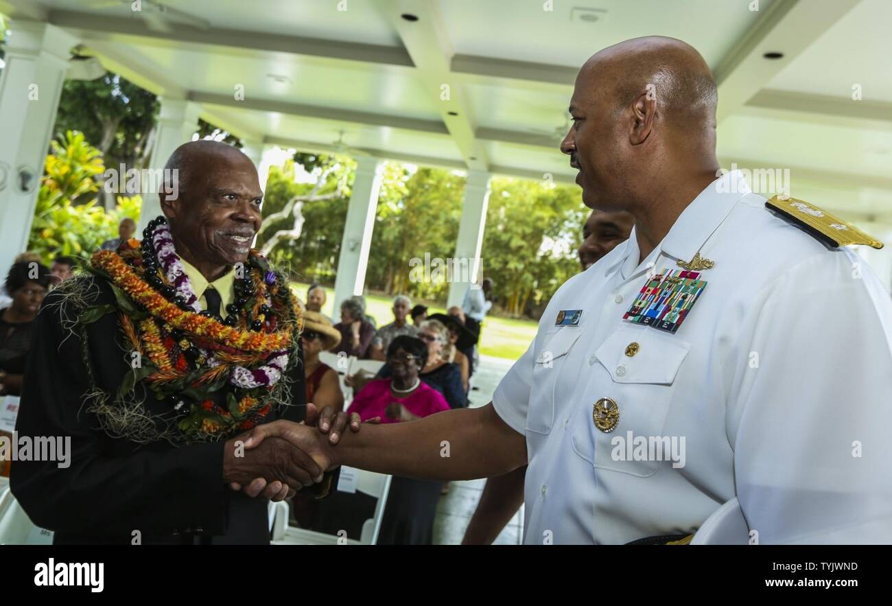 Dr. Ernest James Harris, Jr. greets U.S. Navy Rear Adm. John Fuller ...