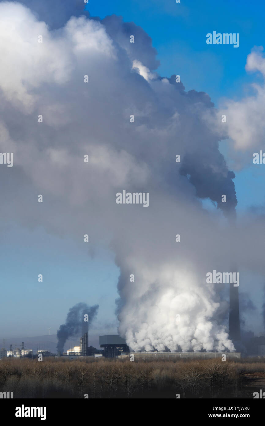 Chemical plant flue gas emissions, thick smoke billowing, cover the sun ...