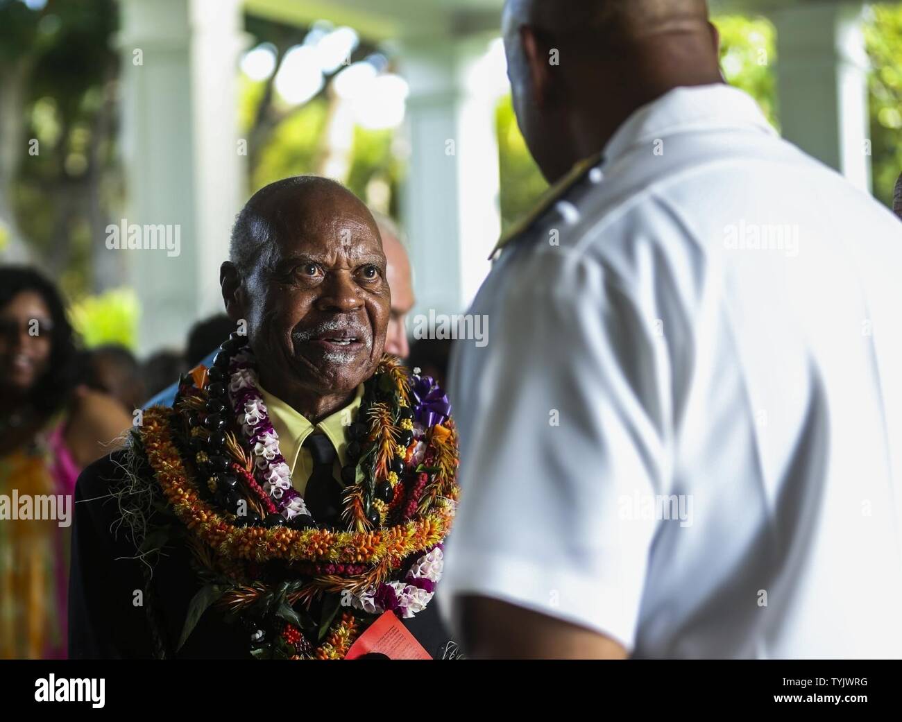 Dr. Ernest James Harris, Jr. greets U.S. Navy Rear Adm. John Fuller ...