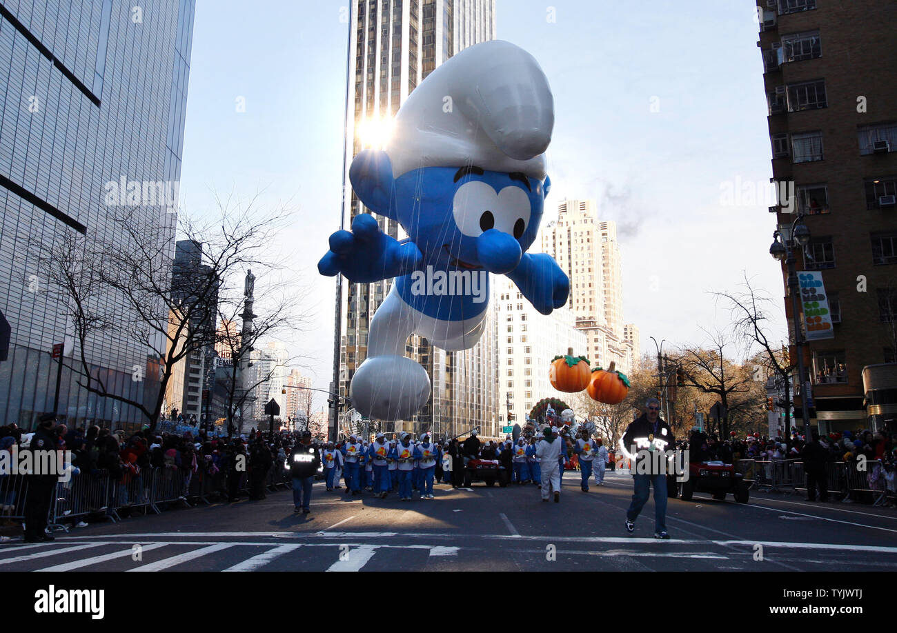 A giant Smurf balloon floats down the parade route at the Macy's 82nd ...