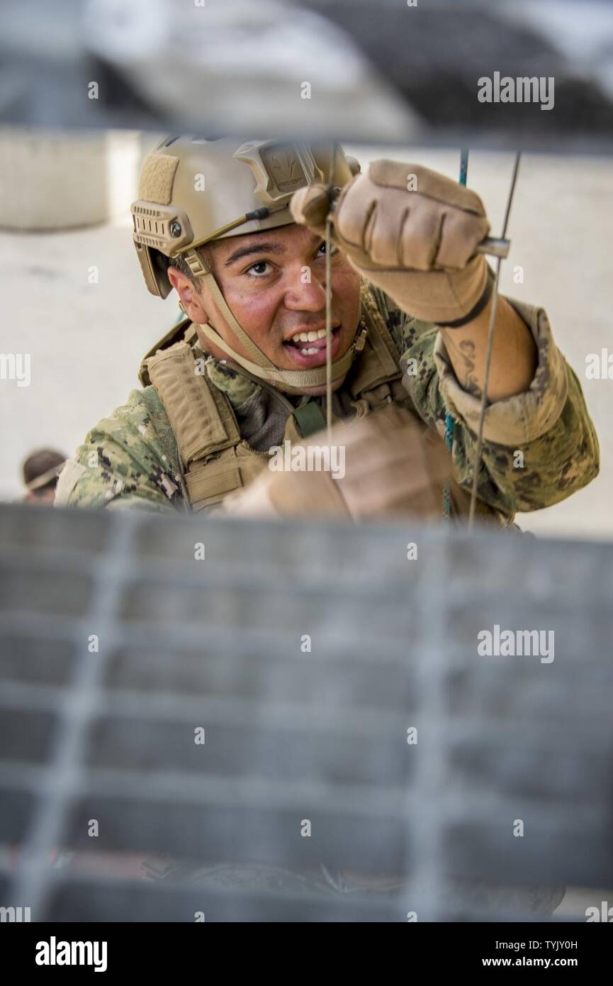 Petty Officer 2nd Class Ridge Leoni, assigned to Expeditionary Combat ...